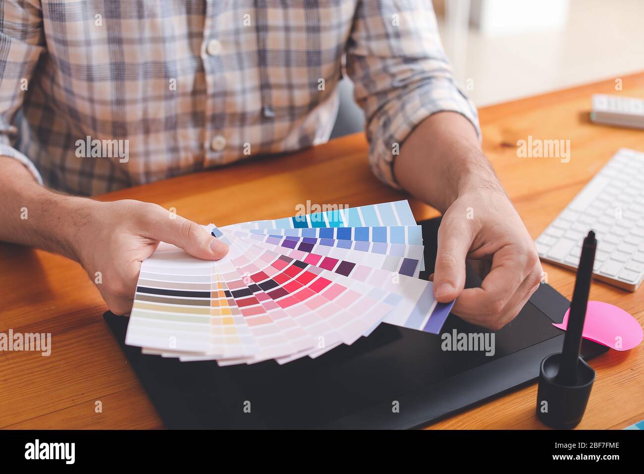 Male designer with color palettes in office, closeup Stock Photo - Alamy