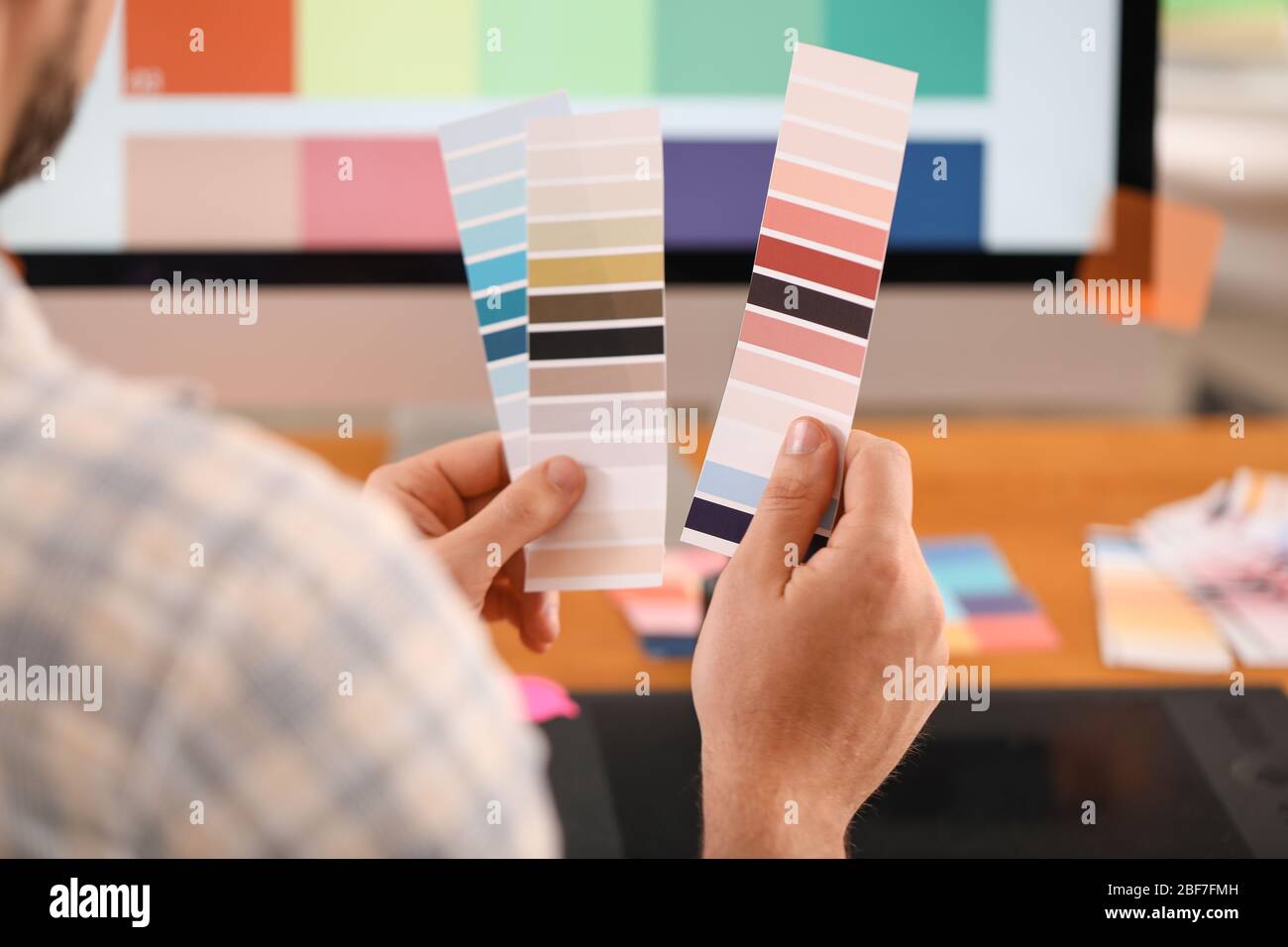 Male designer with color palettes in office, closeup Stock Photo - Alamy
