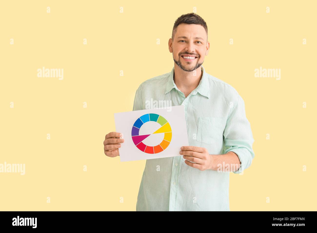 Man with color palette on light background Stock Photo - Alamy