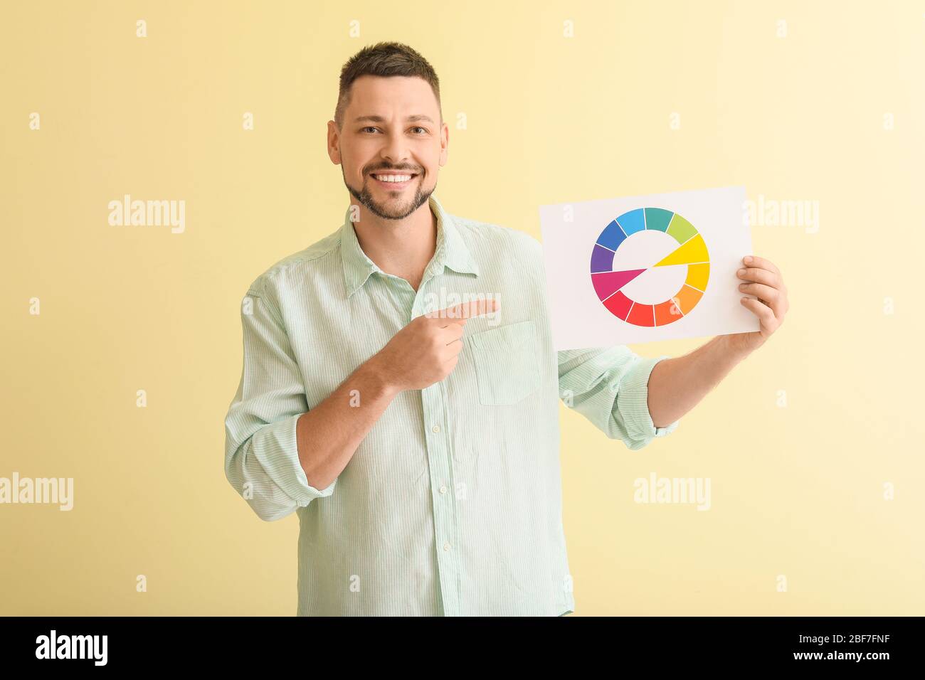 Man with color palette on light background Stock Photo - Alamy