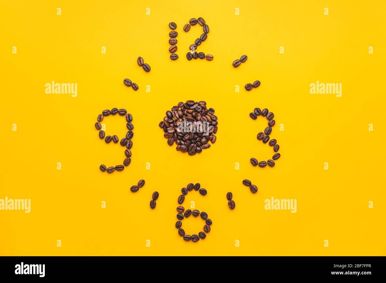 Creative clock made of coffee beans on color background Stock Photo - Alamy