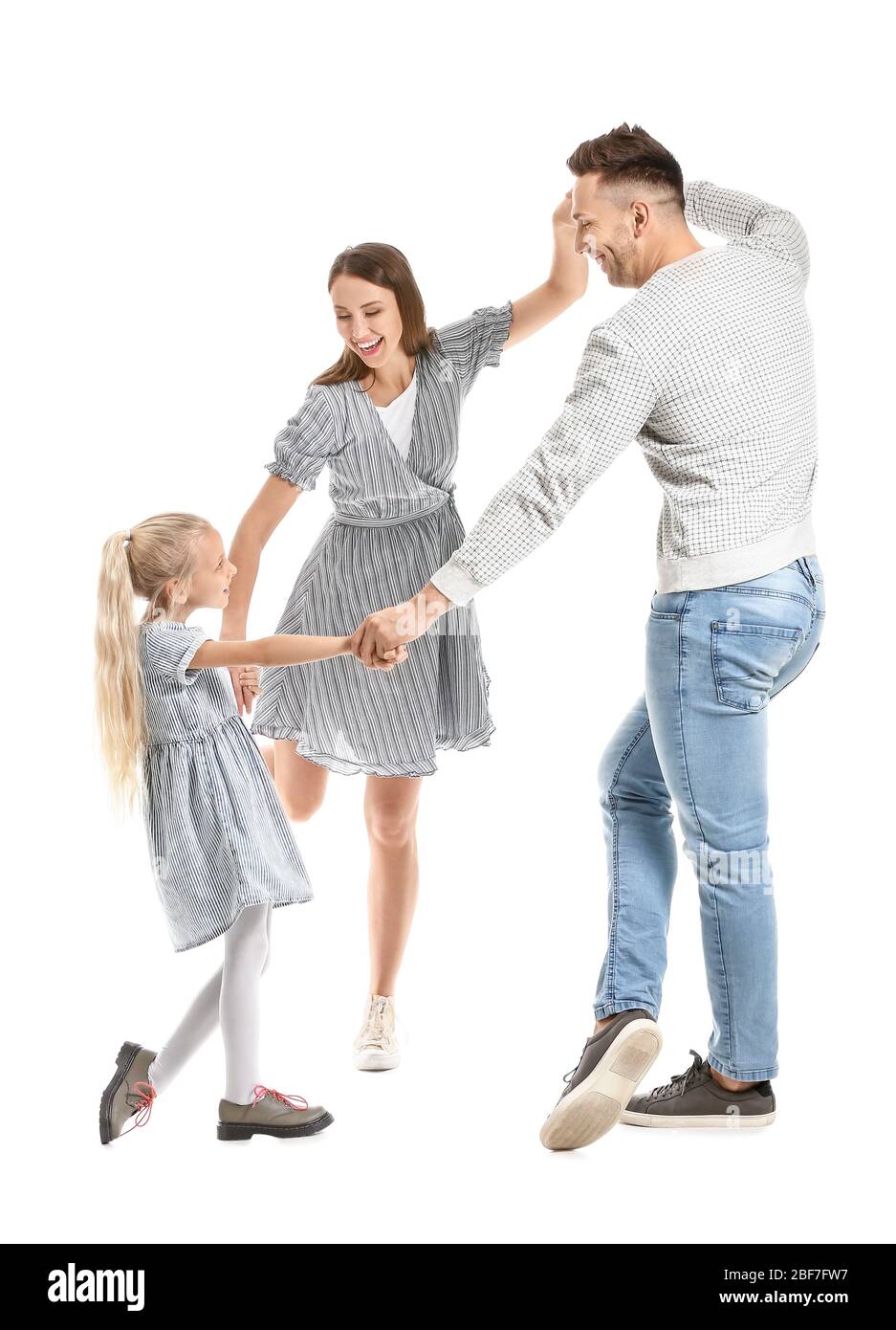 Happy family dancing against white background Stock Photo - Alamy