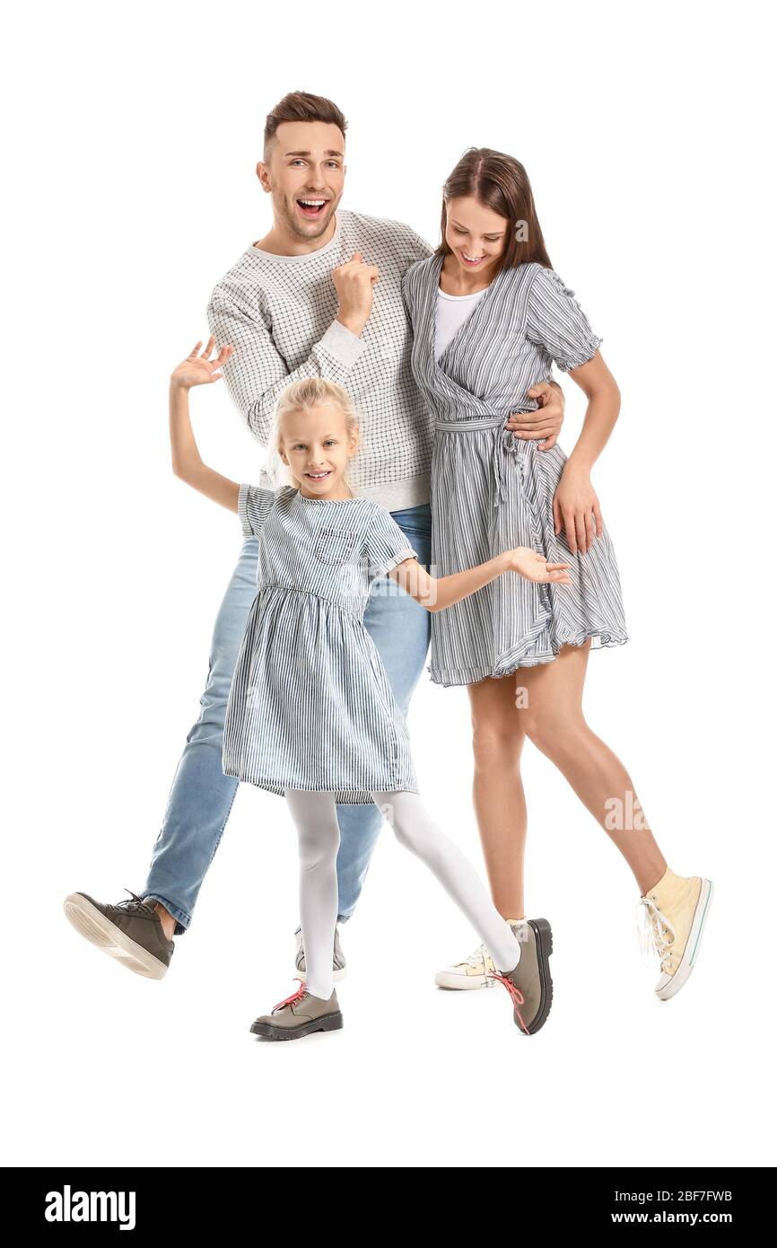 Happy family dancing against white background Stock Photo - Alamy