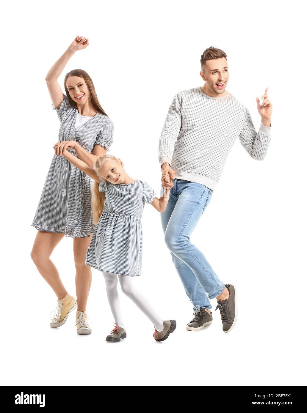 Happy family dancing against white background Stock Photo - Alamy