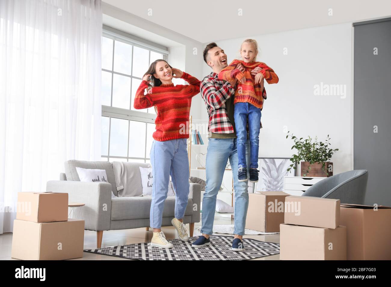 Happy family dancing at home Stock Photo - Alamy