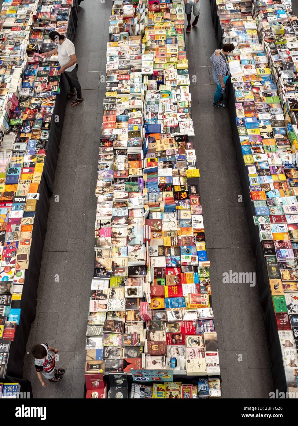 Indoor book market. Candid high angle view of a group of customers ...