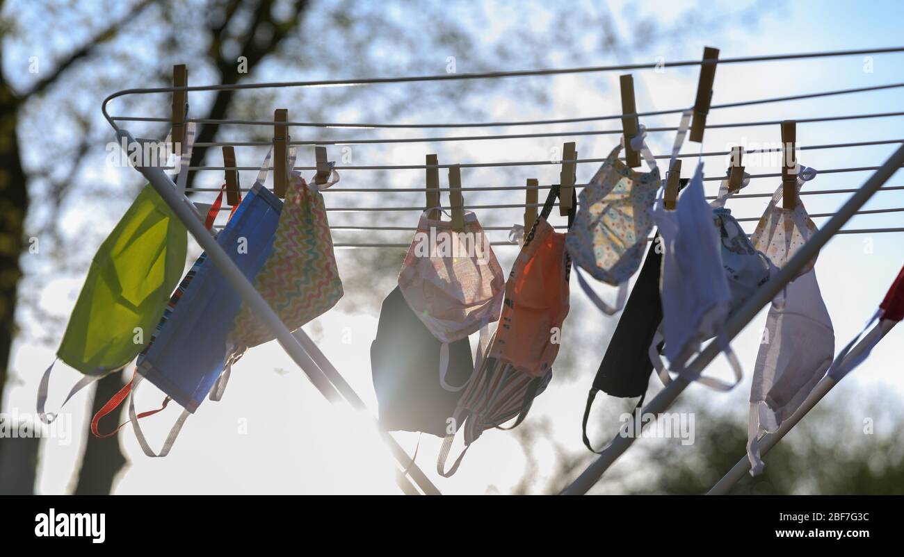 Hygienic mask hanging on the rack outdoor after being washed for ...