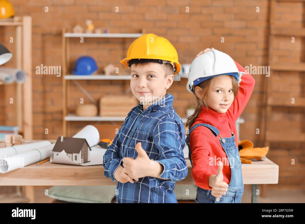 Cute little architects in office Stock Photo - Alamy