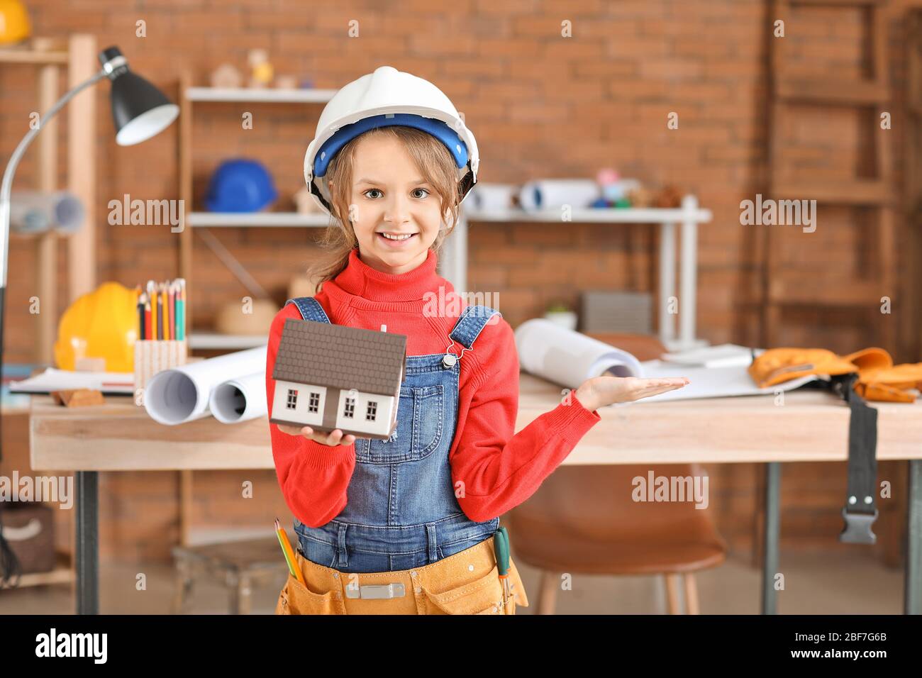 Cute little architect in office Stock Photo - Alamy