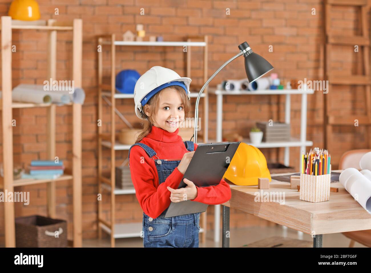 Cute little architect in office Stock Photo - Alamy