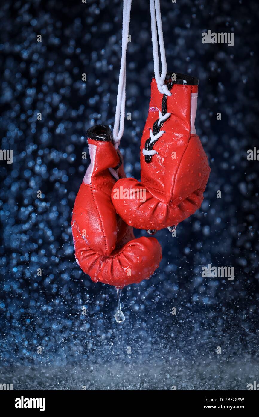 Red boxing gloves on a water drops background. Sport lifestyle ...