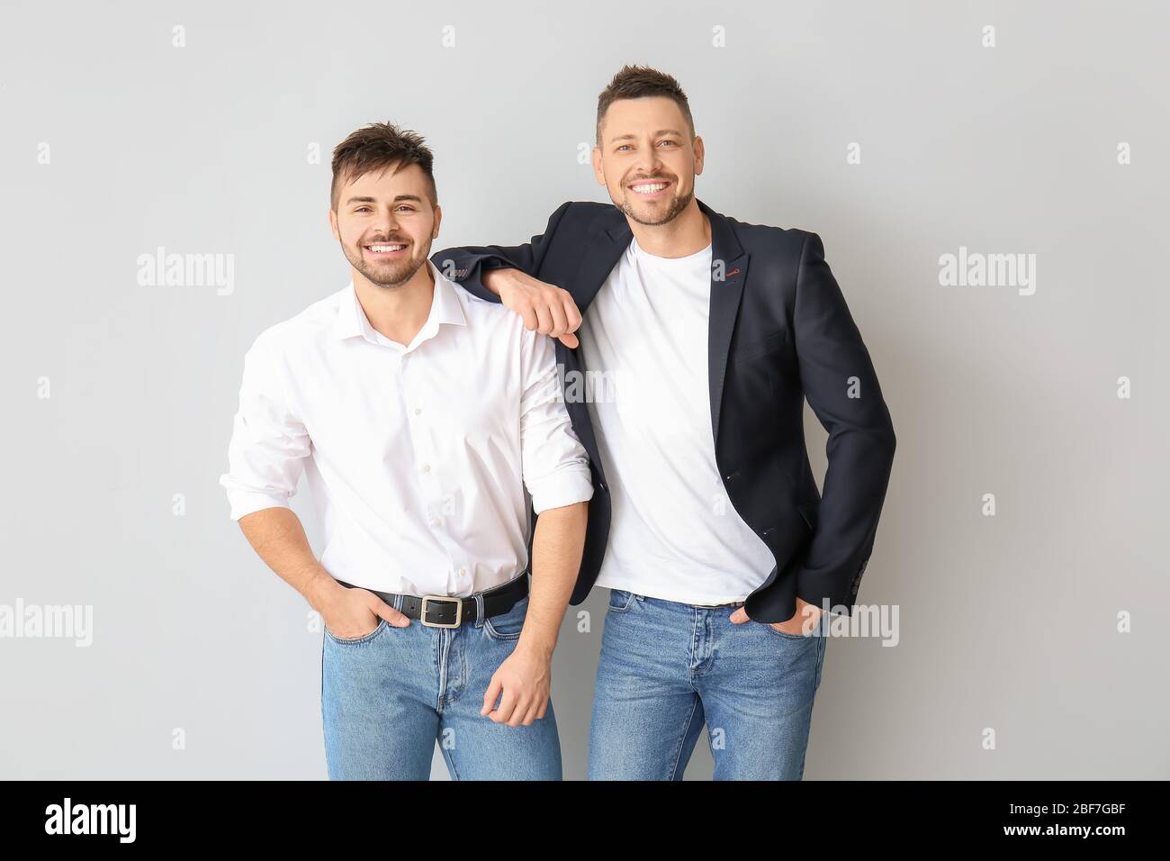 Portrait of happy friends on white background Stock Photo - Alamy