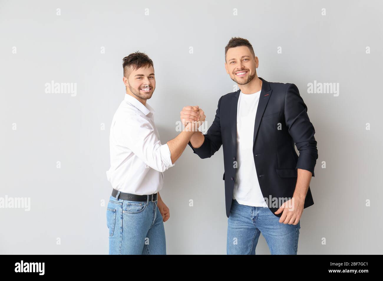 Portrait of happy friends on white background Stock Photo - Alamy