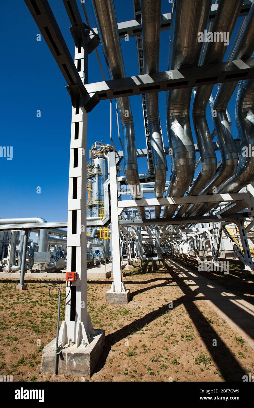 Oil refinery and gas processing plant in a desert. Pipeline and a ...