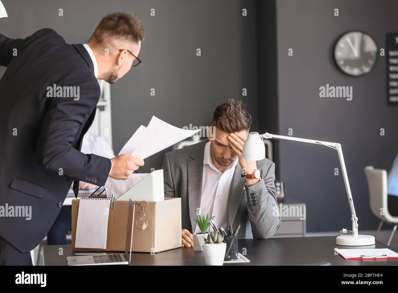 Angry boss firing office worker Stock Photo - Alamy