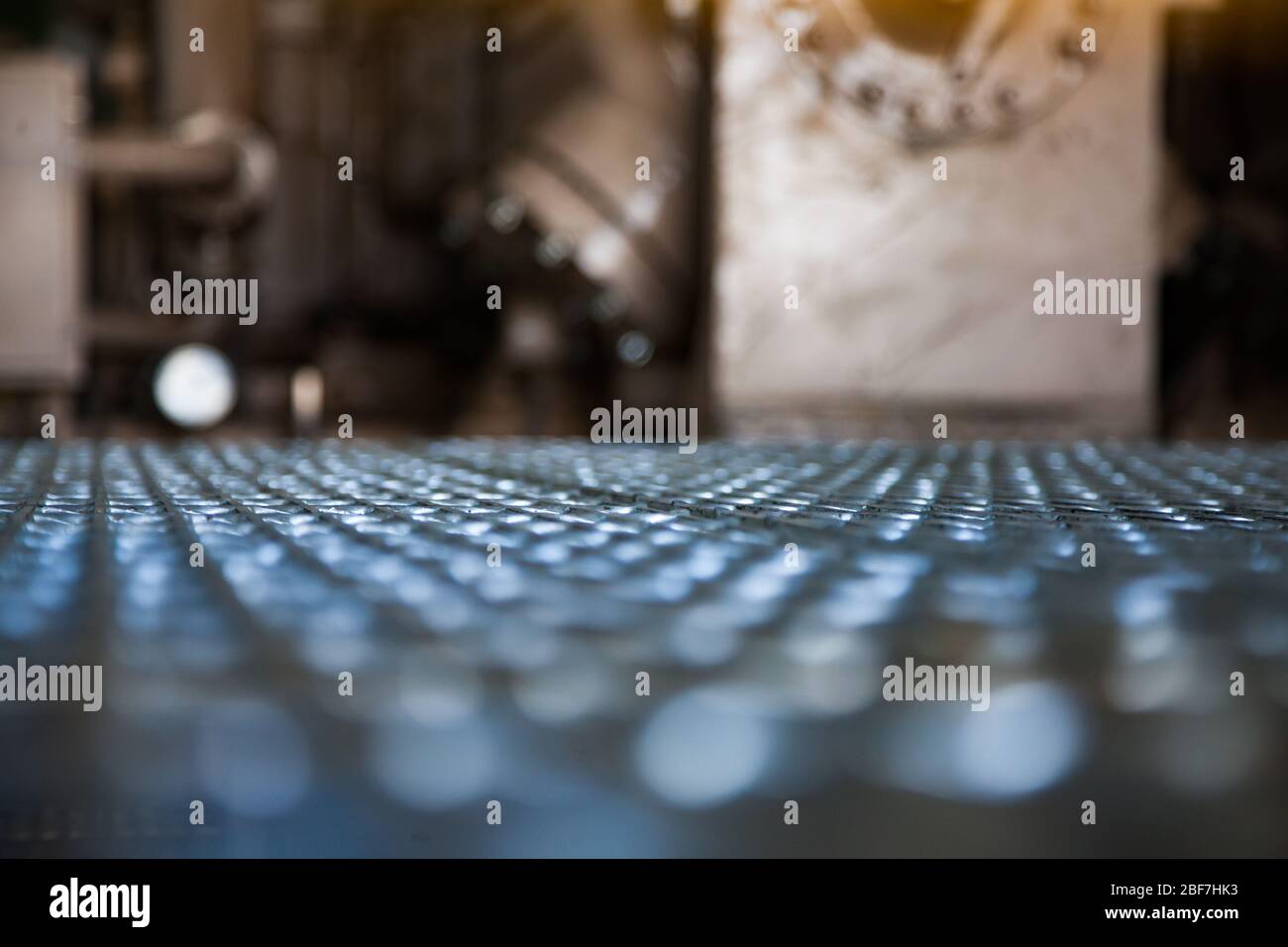 Abstract industrial background. A grid floor in factory warehouse ...
