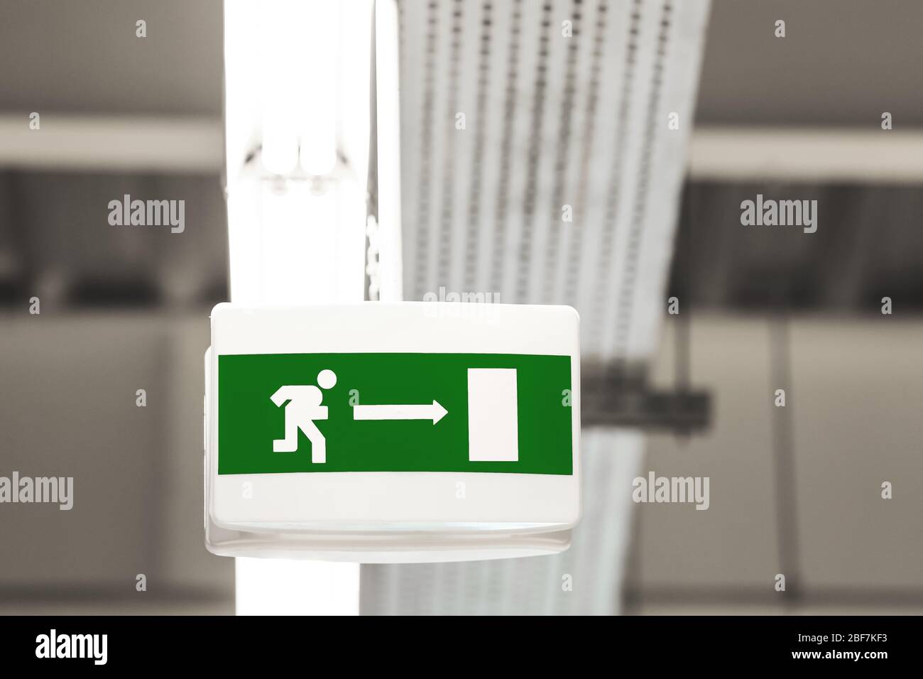Fire exit sign in building Stock Photo - Alamy
