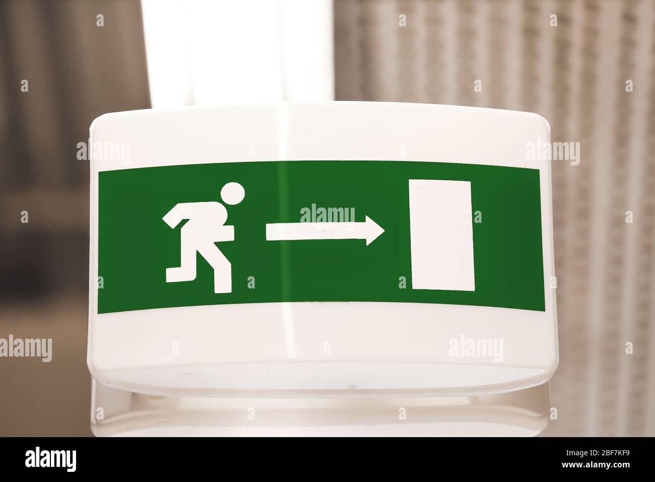 Fire exit sign in building Stock Photo - Alamy