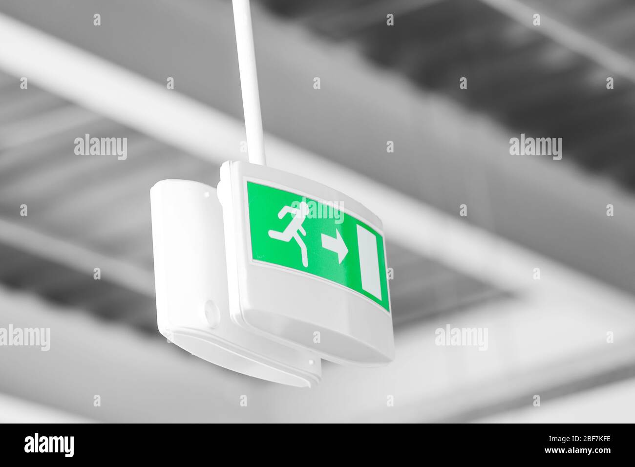 Fire exit sign in building Stock Photo - Alamy