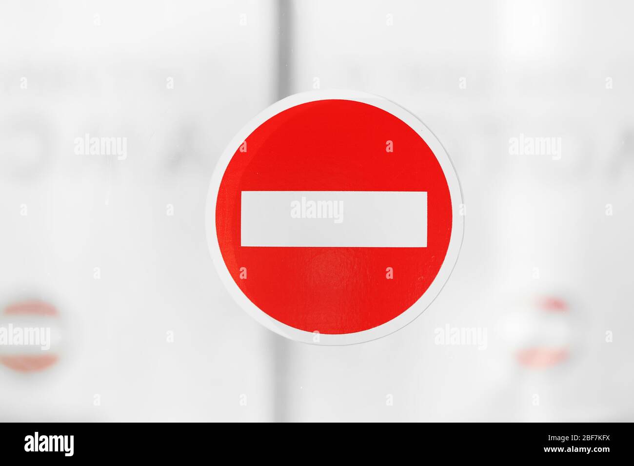 "Do not enter" sign on glass door in building Stock Photo - Alamy
