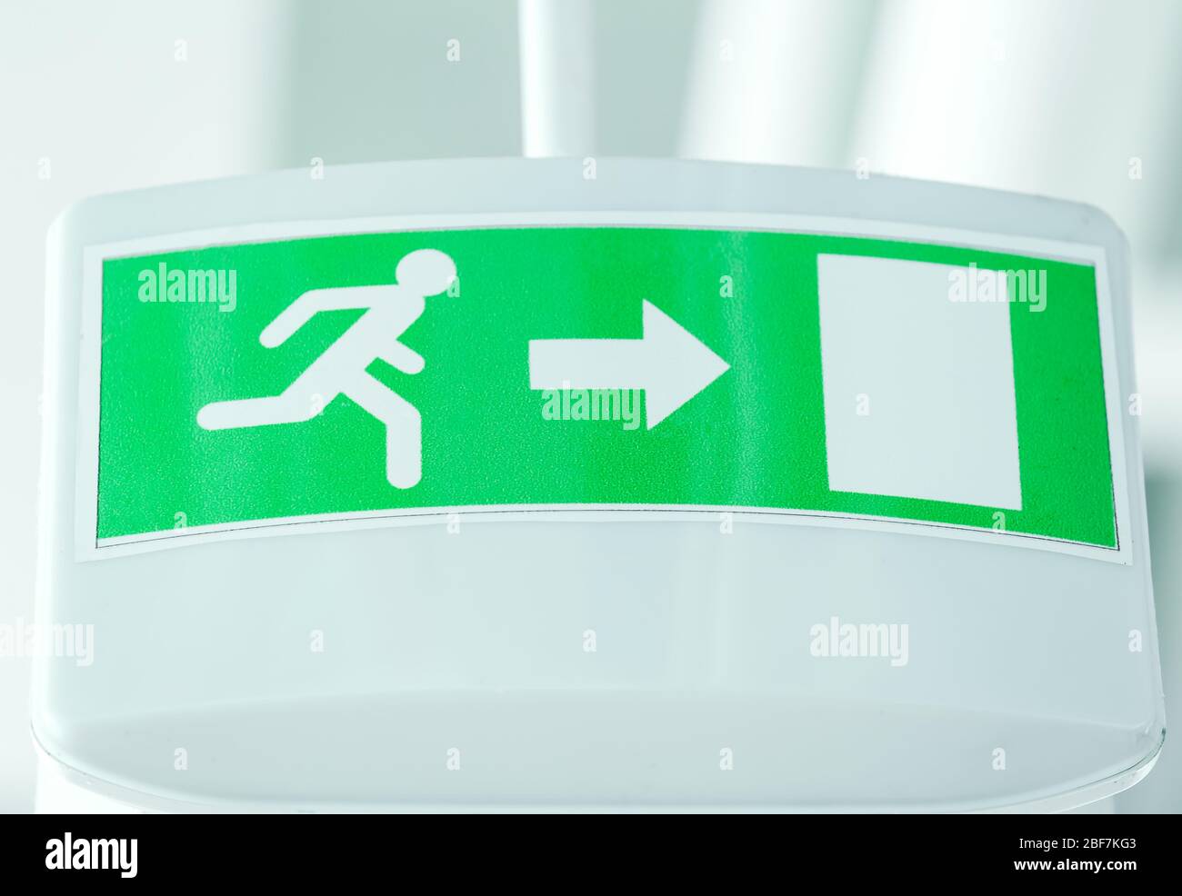 Fire exit sign in building Stock Photo - Alamy