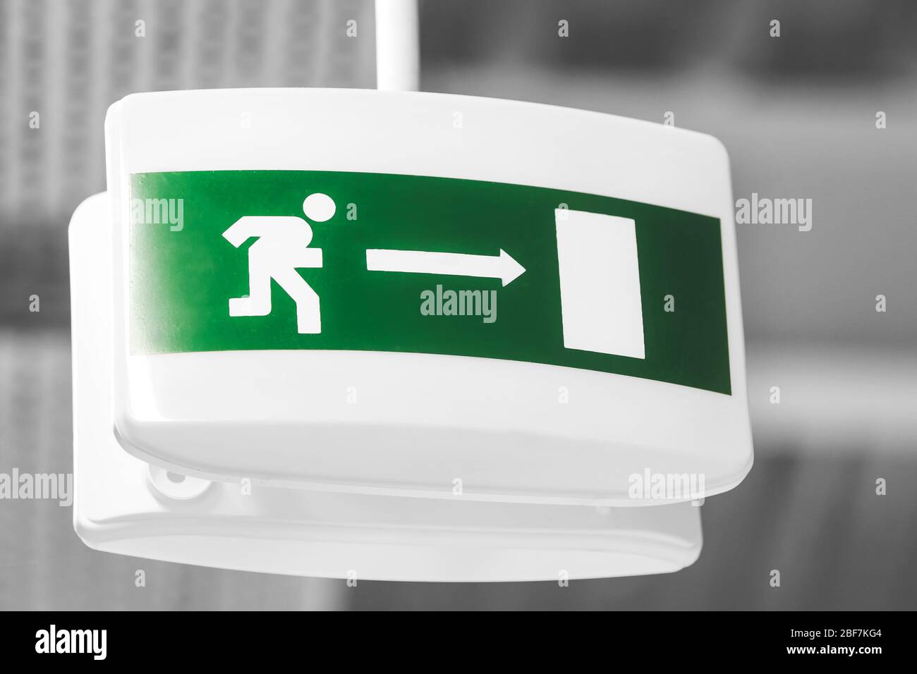 Fire exit sign in building Stock Photo - Alamy