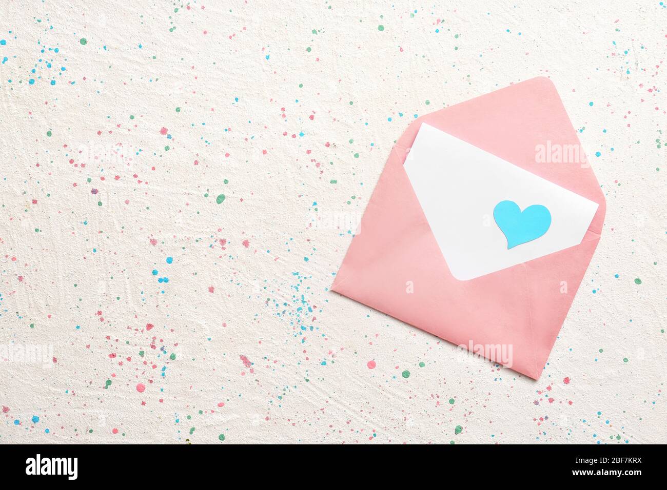 Paper envelope with letter on light background Stock Photo - Alamy