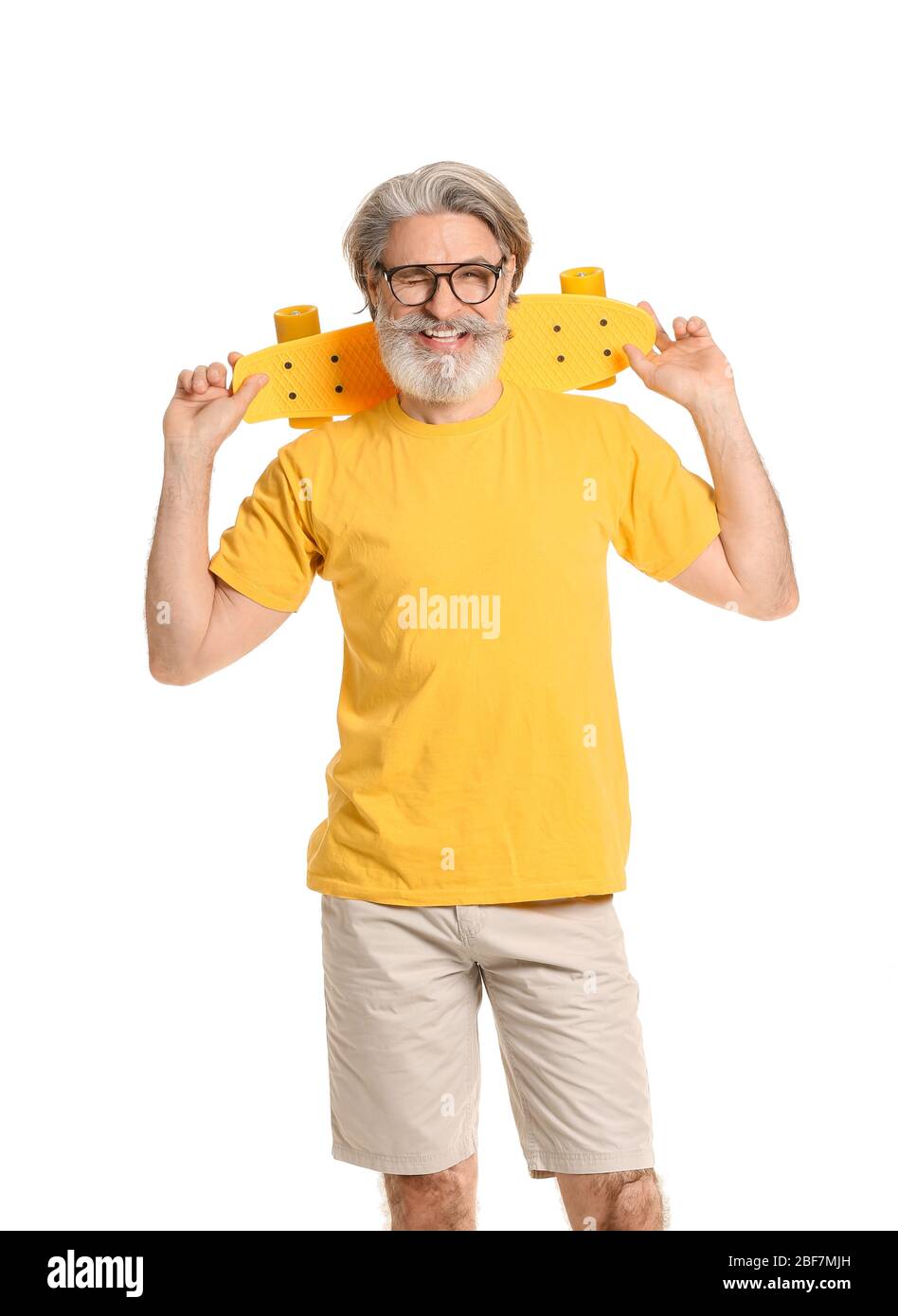 Stylish elderly man with skateboard on white background Stock Photo - Alamy
