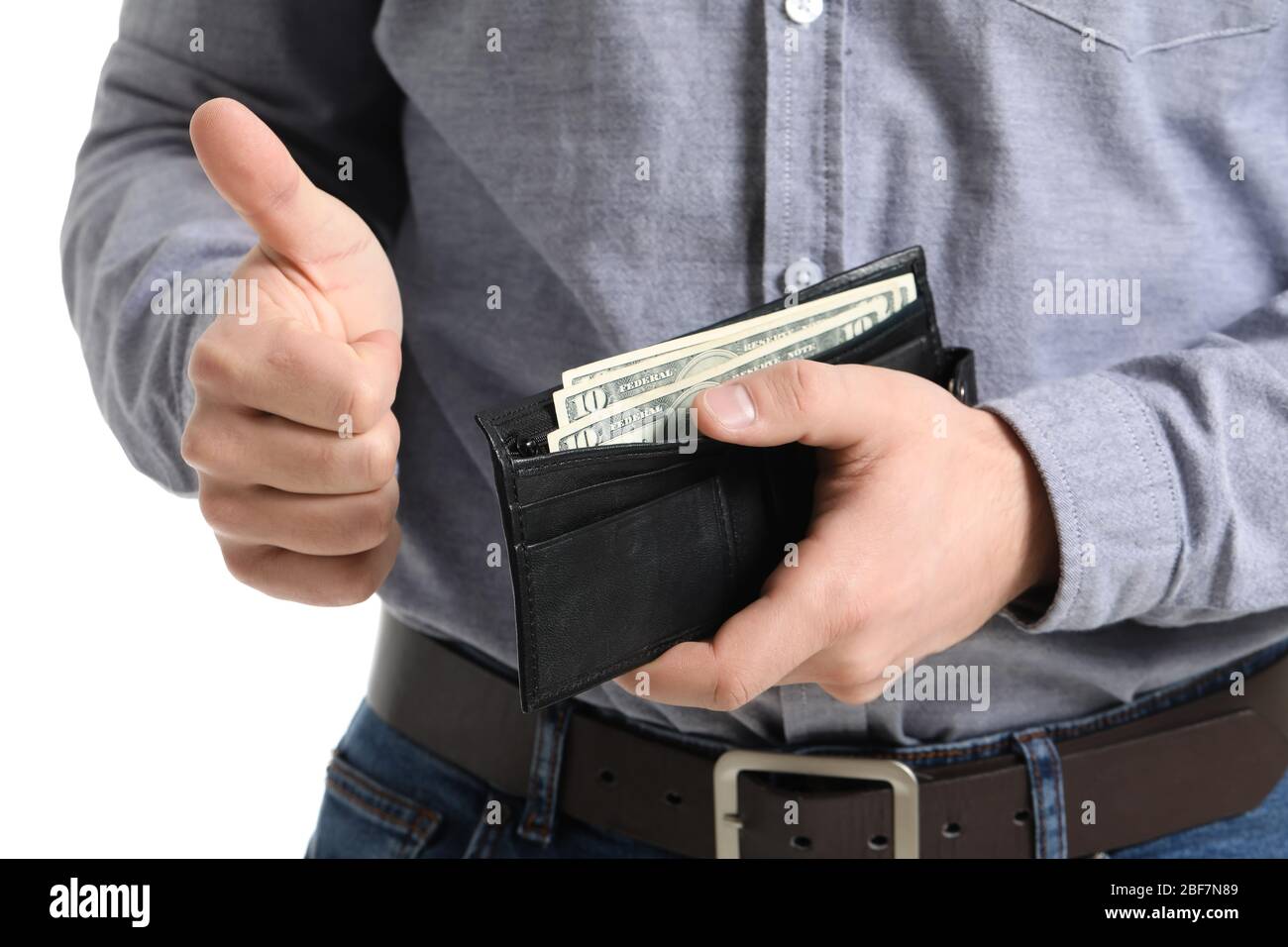 Man with purse showing thumb-up on white background, closeup Stock ...
