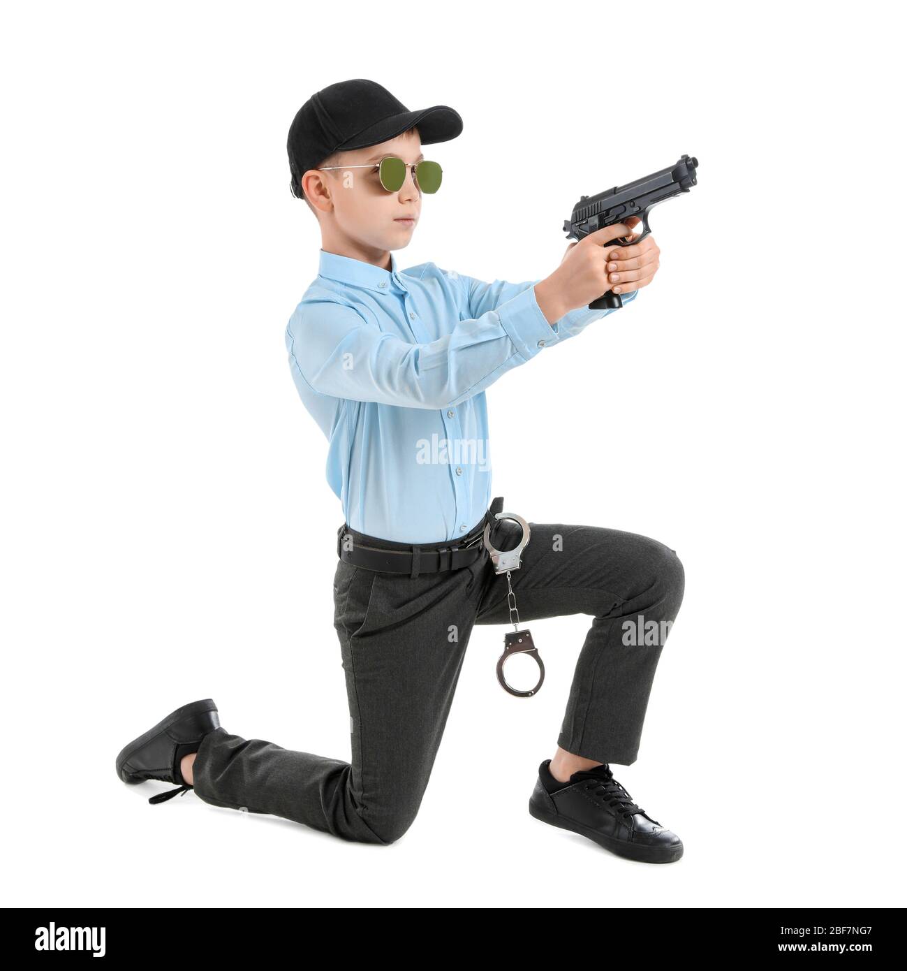 Cute little police officer on white background Stock Photo - Alamy