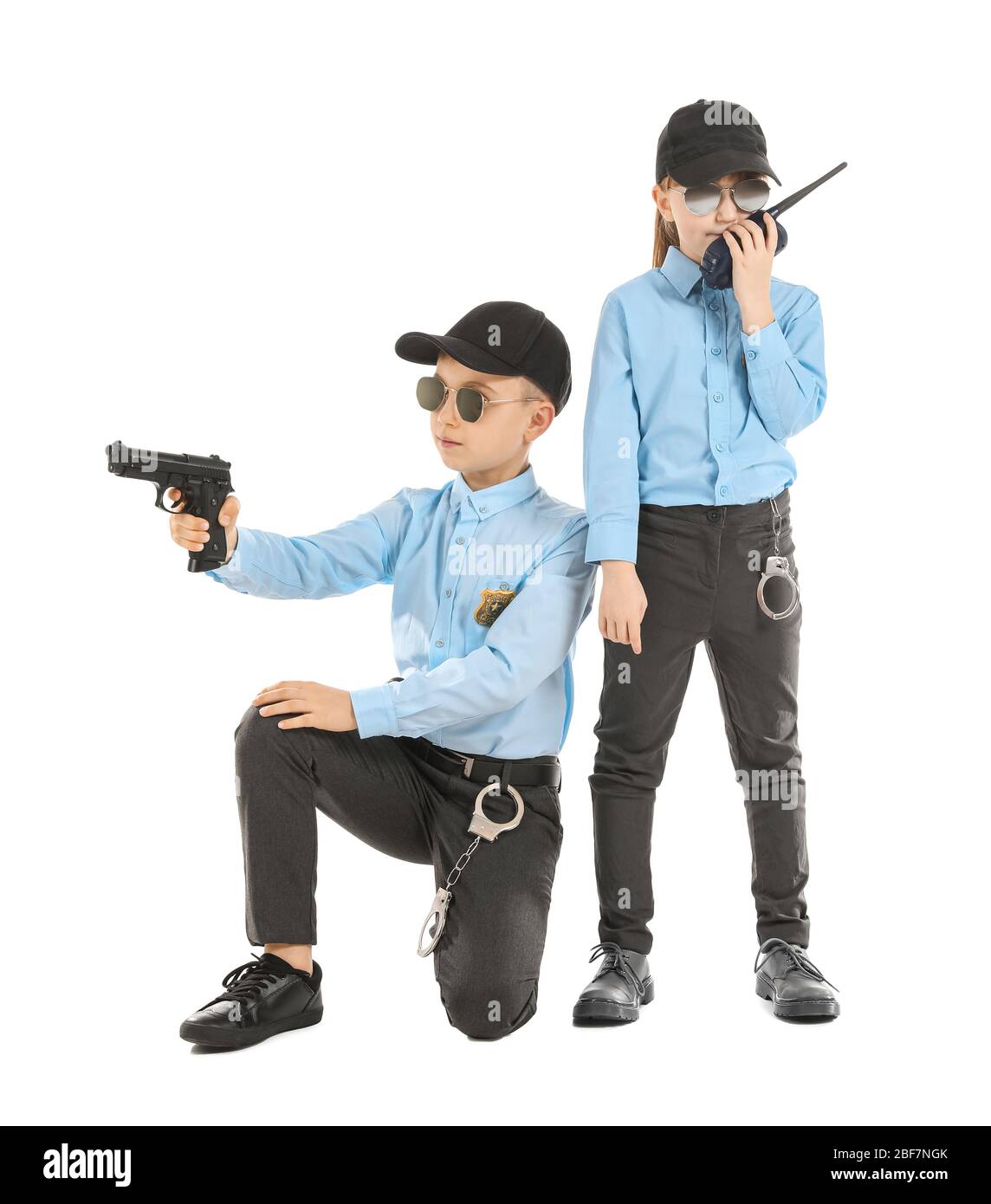 Cute little police officers on white background Stock Photo - Alamy