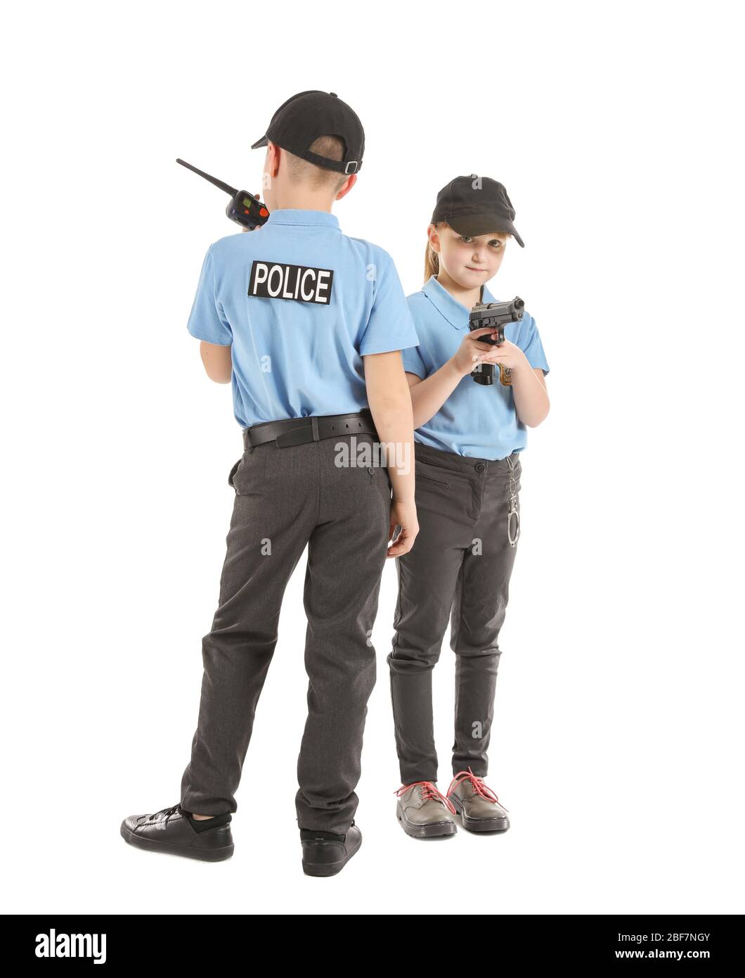 Cute little police officers on white background Stock Photo - Alamy