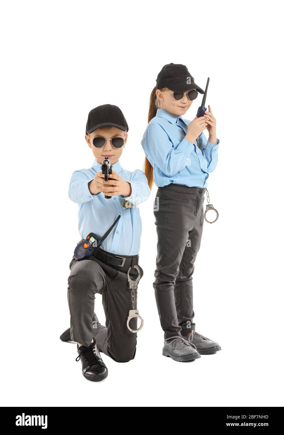 Cute little police officers on white background Stock Photo - Alamy