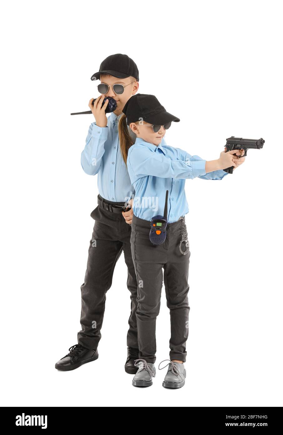 Cute little police officers on white background Stock Photo - Alamy