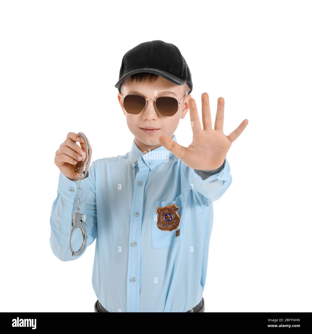Cute little police officer on white background Stock Photo - Alamy