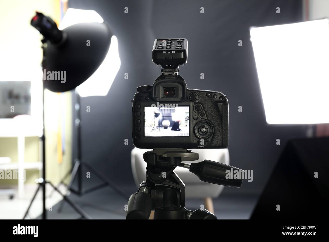 Professional camera on tripod in modern photo studio Stock Photo - Alamy
