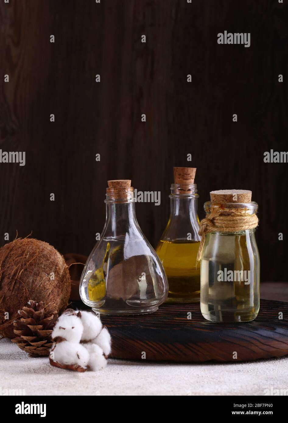 assortment of natural organic oils on a wooden board Stock Photo - Alamy