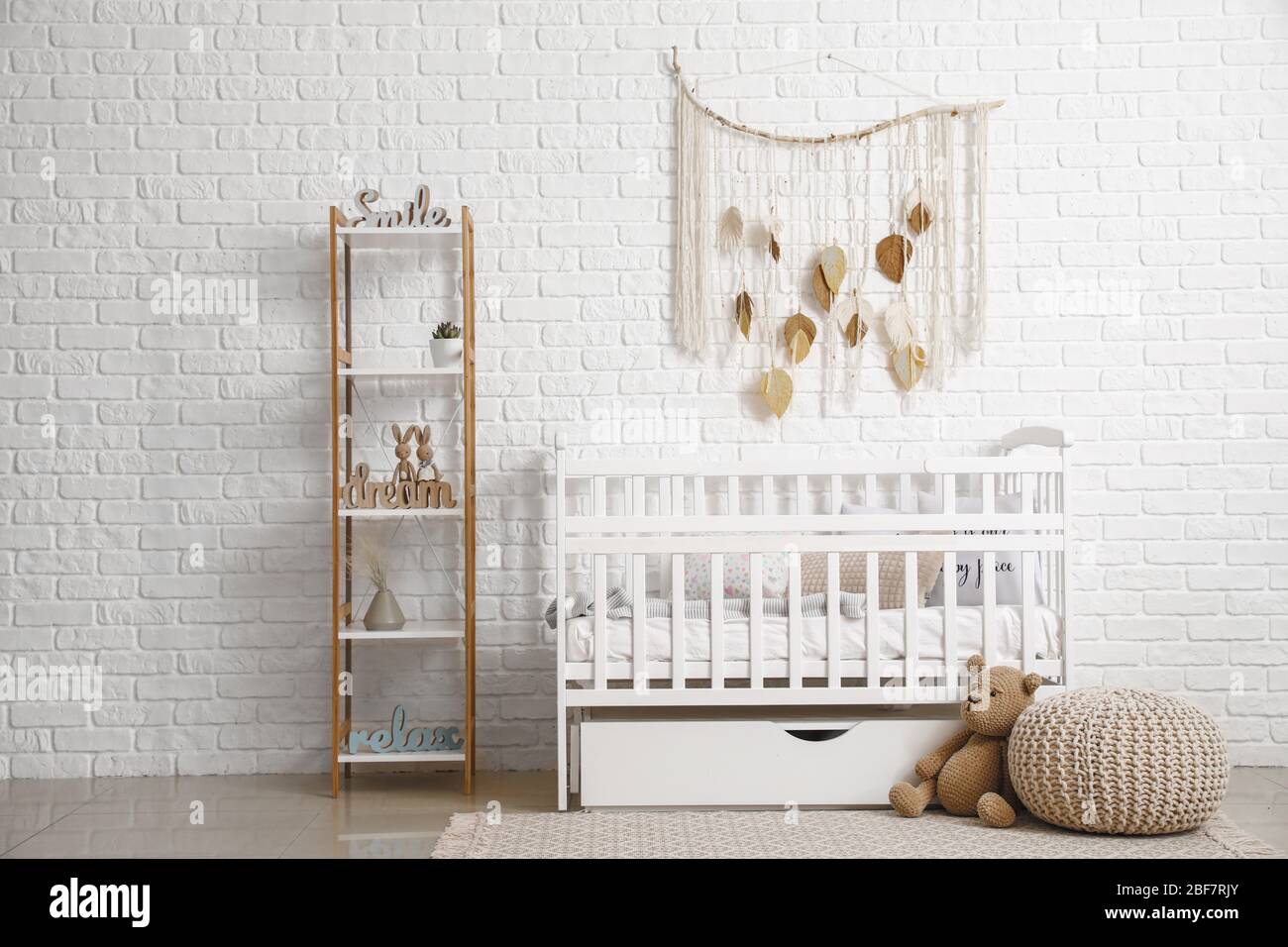 Baby bed with rack in interior of children's room Stock Photo - Alamy