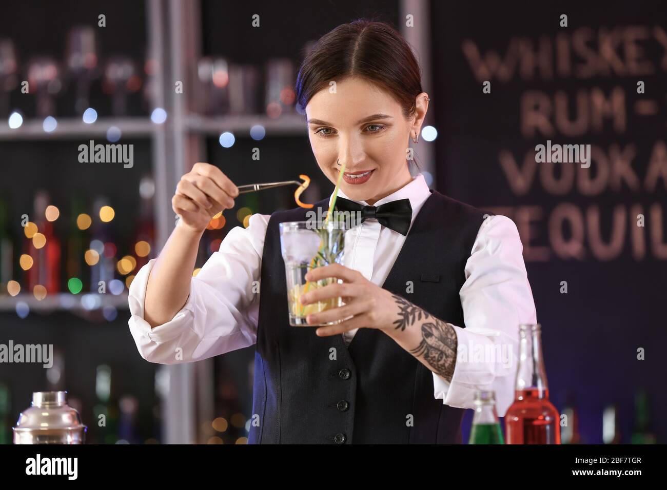 Beautiful female bartender in pub Stock Photo - Alamy