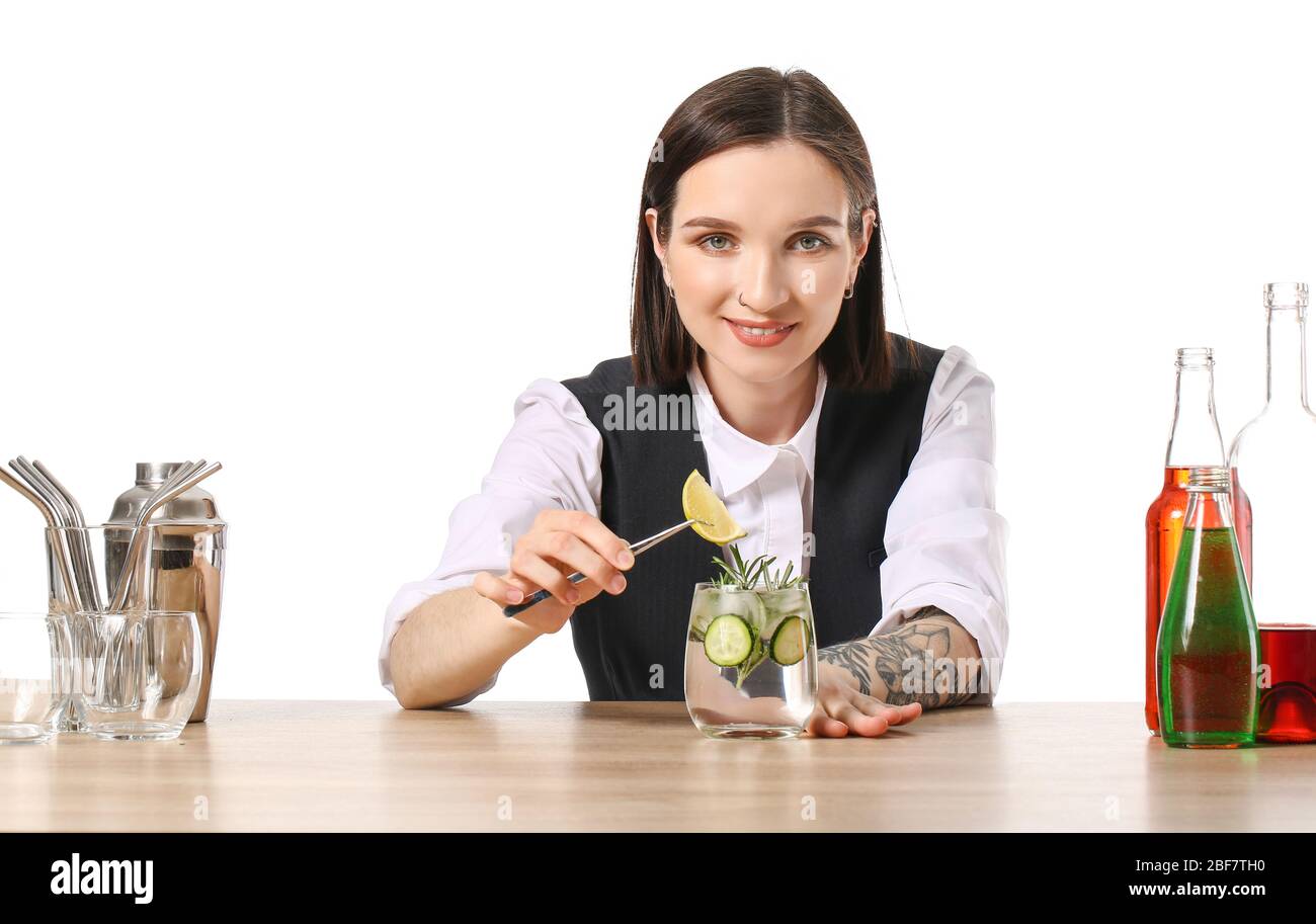 Beautiful female bartender at table against white background Stock ...
