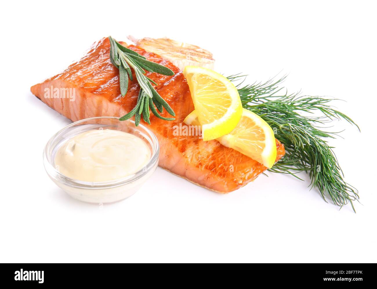 Cooked salmon fillet with sauce on white background Stock Photo - Alamy