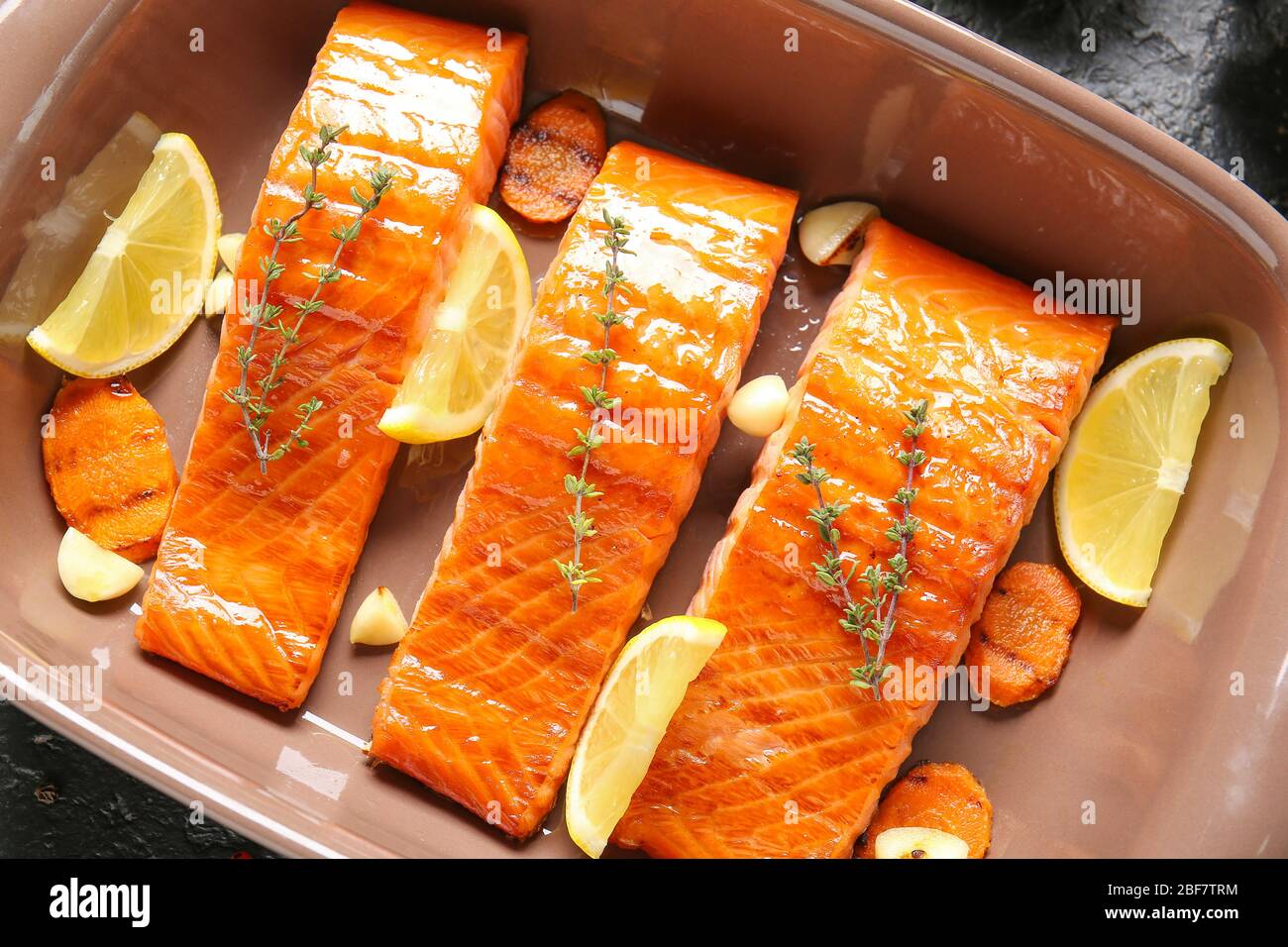 Baking dish with cooked salmon fillet, top view Stock Photo - Alamy