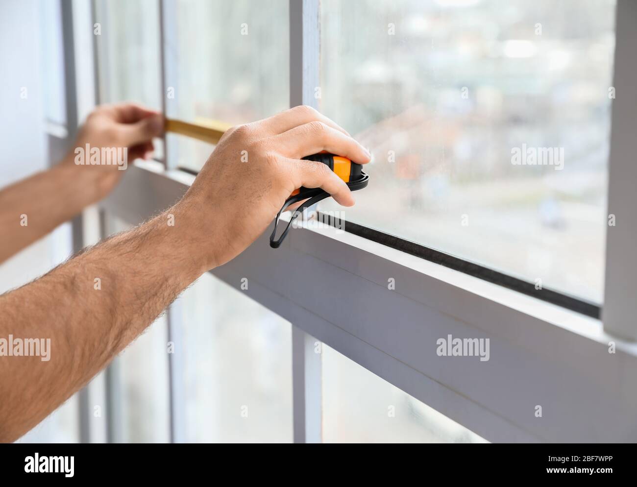 Male builder measuring window hi-res stock photography and images - Alamy