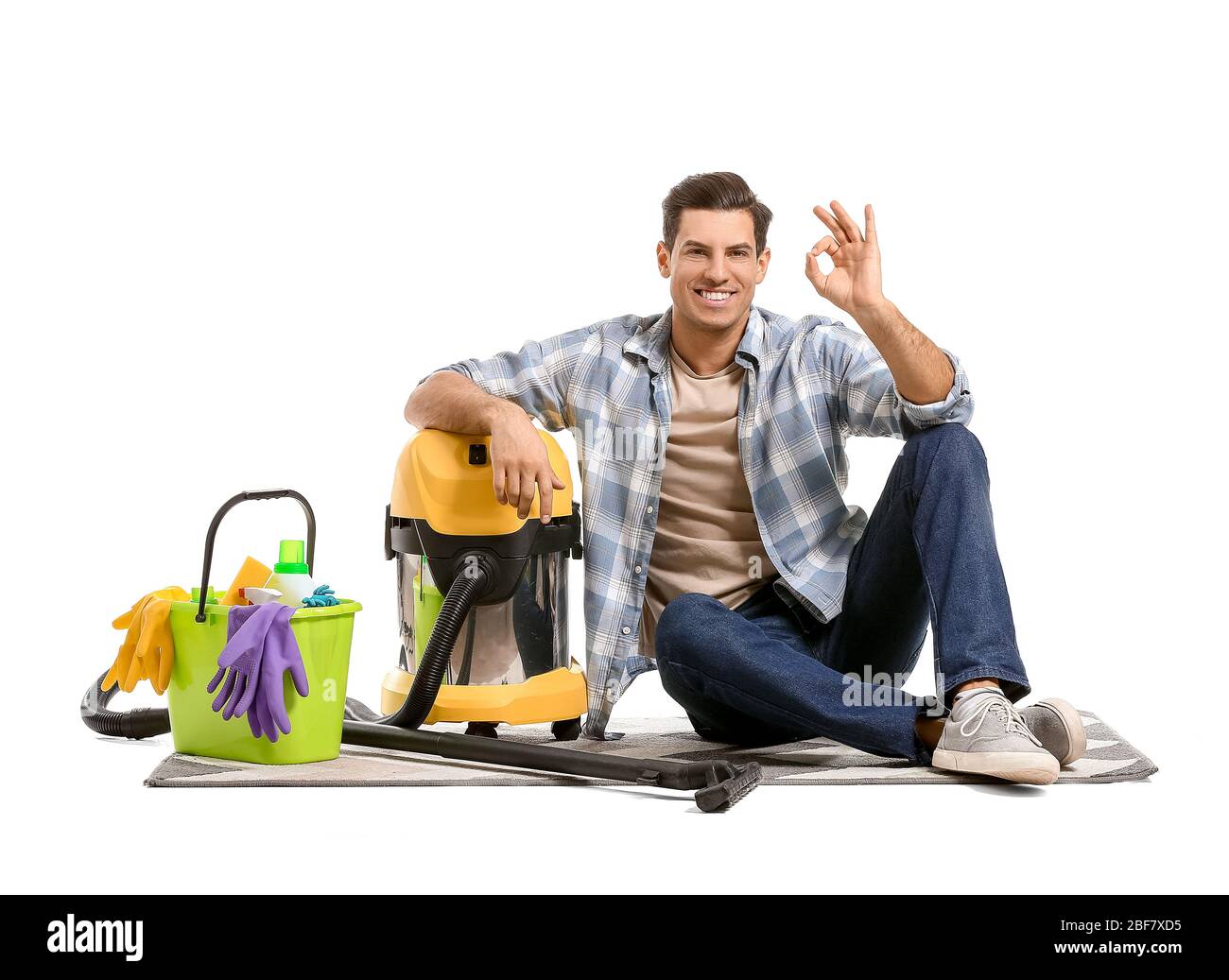 Man cleaning carpet vacuum cleaner Cut Out Stock Images & Pictures - Alamy