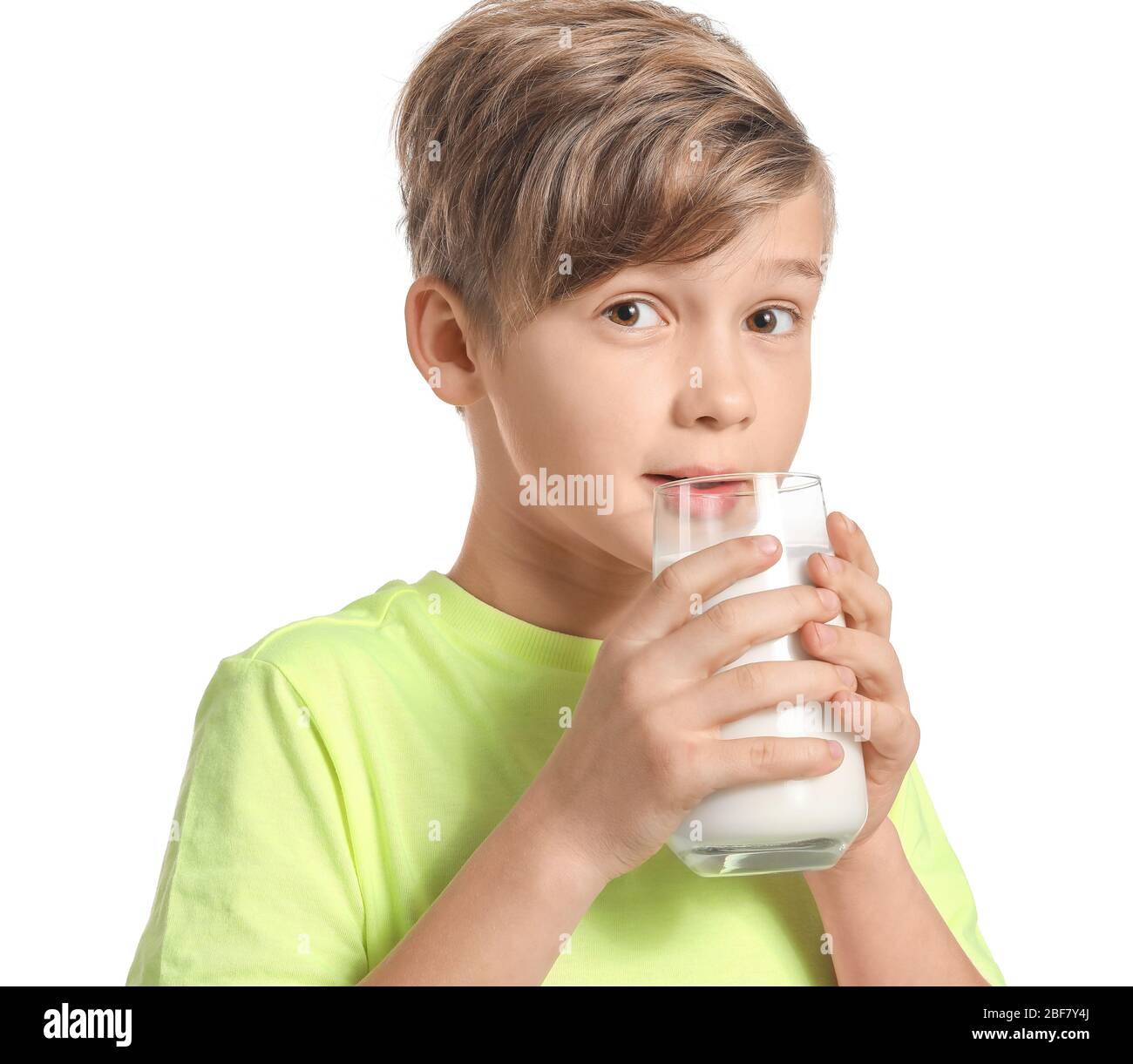 Little boy with milk on white background Stock Photo - Alamy