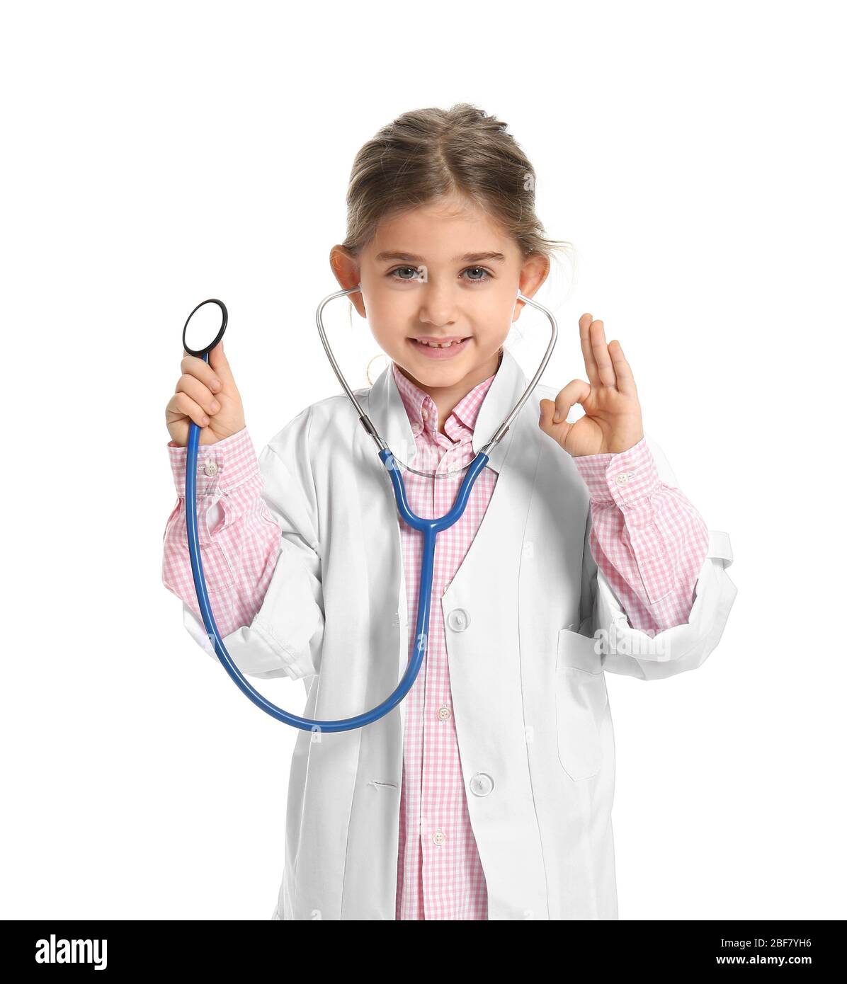 Cute little doctor on white background Stock Photo - Alamy