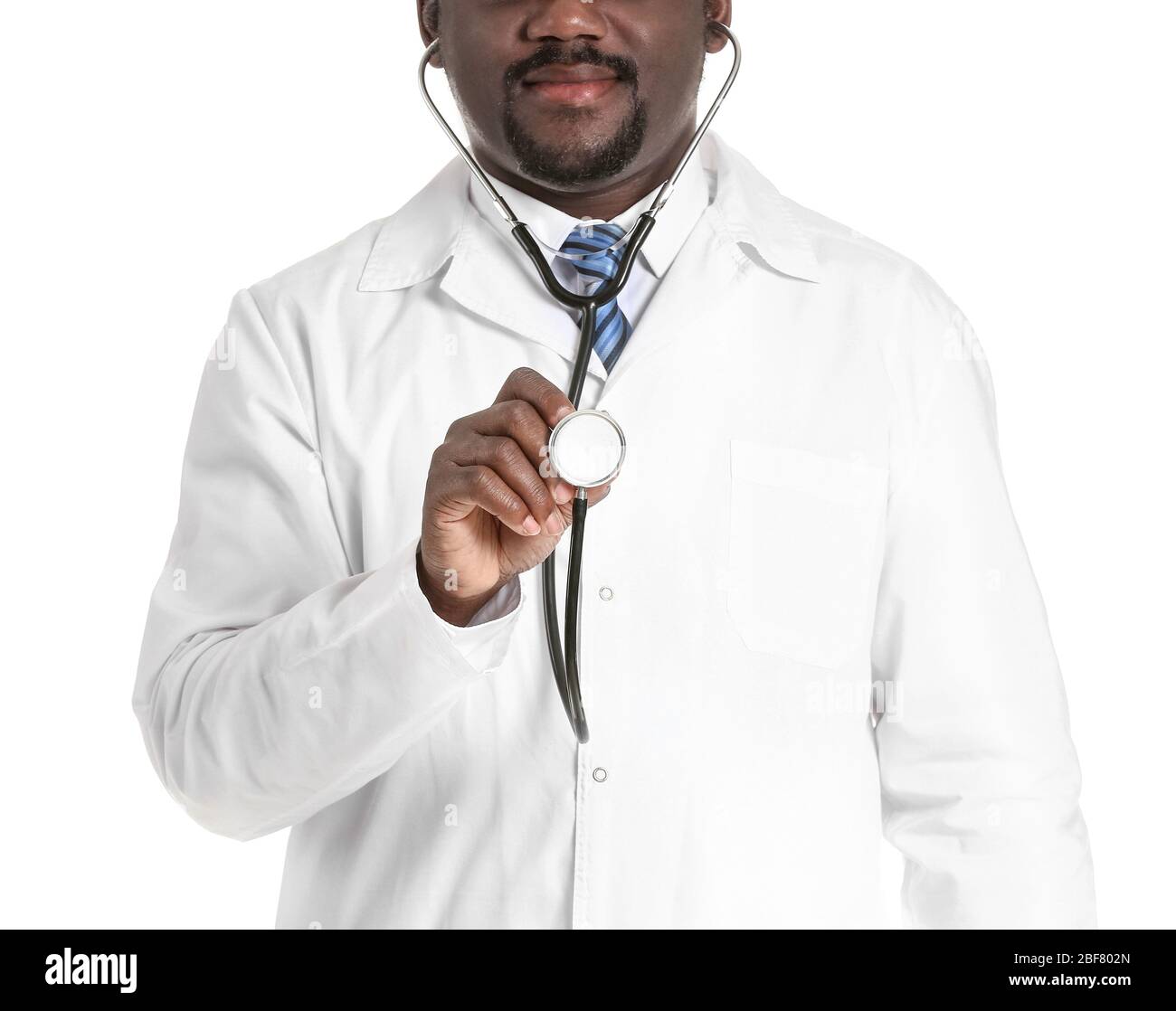 Male African-American doctor with stethoscope on white background Stock ...