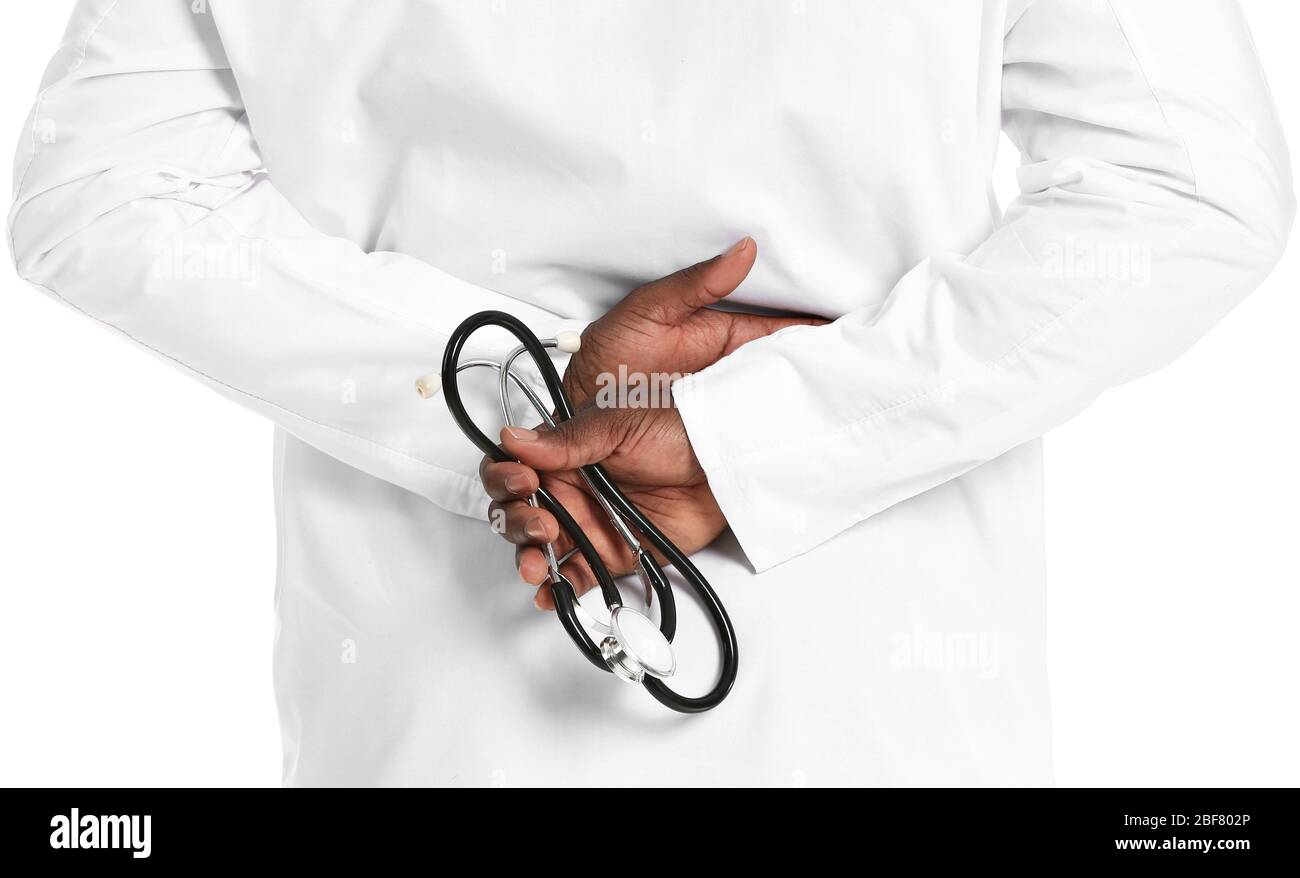 Male African-American doctor with stethoscope on white background Stock ...