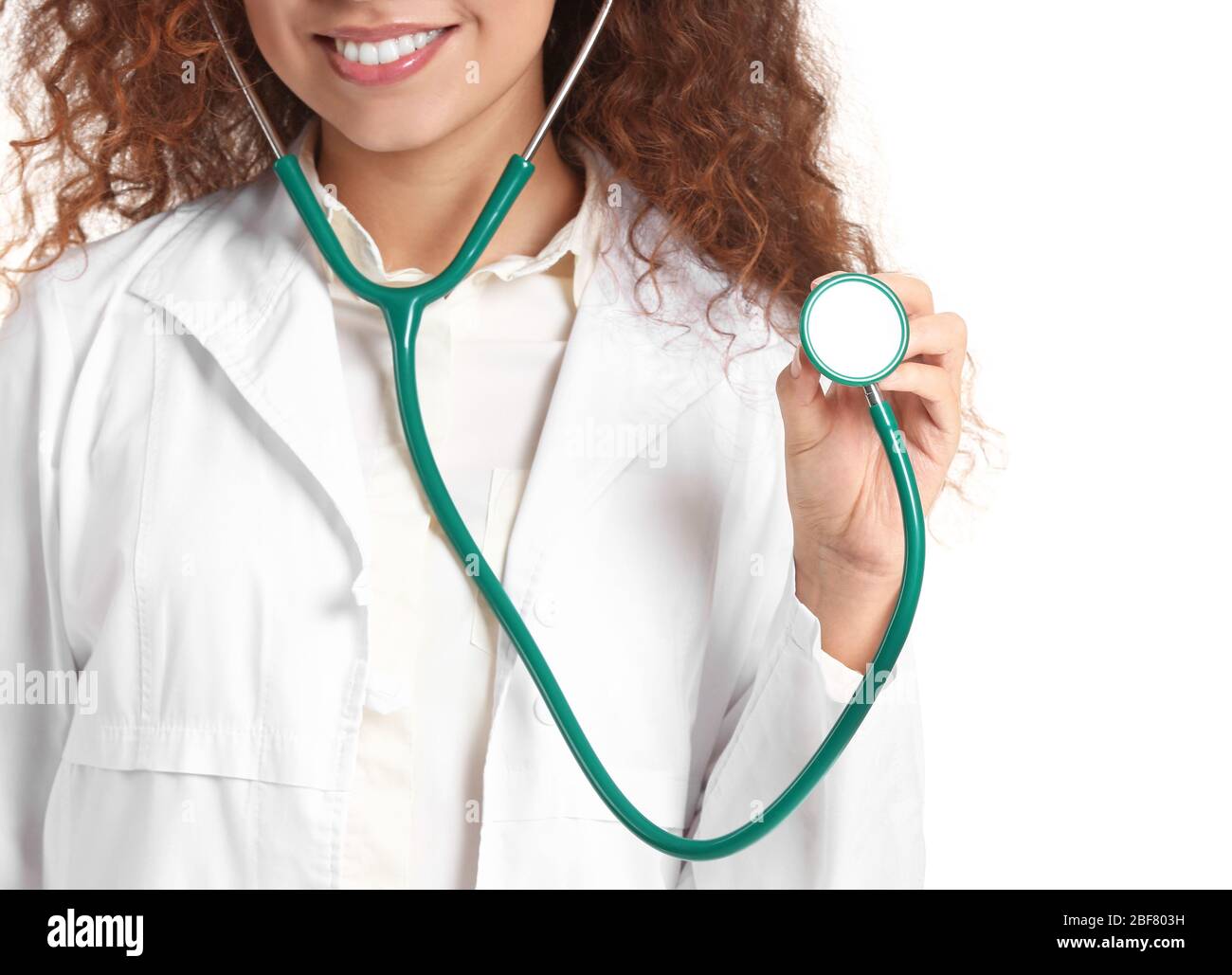 Young African-American doctor with stethoscope on white background ...