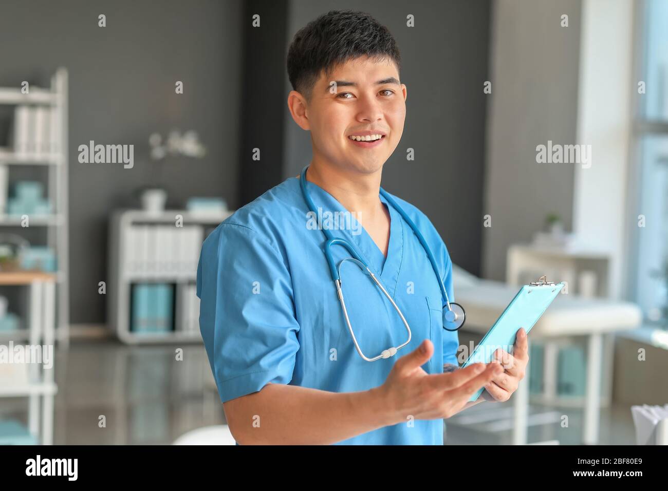 Male Asian doctor in clinic Stock Photo - Alamy